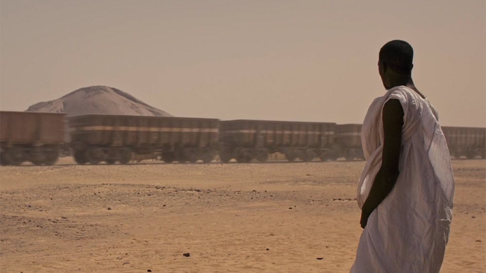 Careening through the desert, a massive railway sustains life in ...